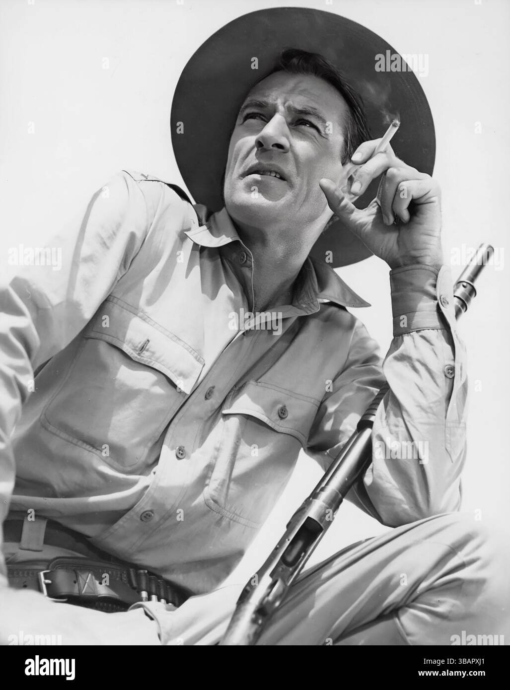 A smoking Gary Cooper in The Real Glory (1939 Stock Photo - Alamy