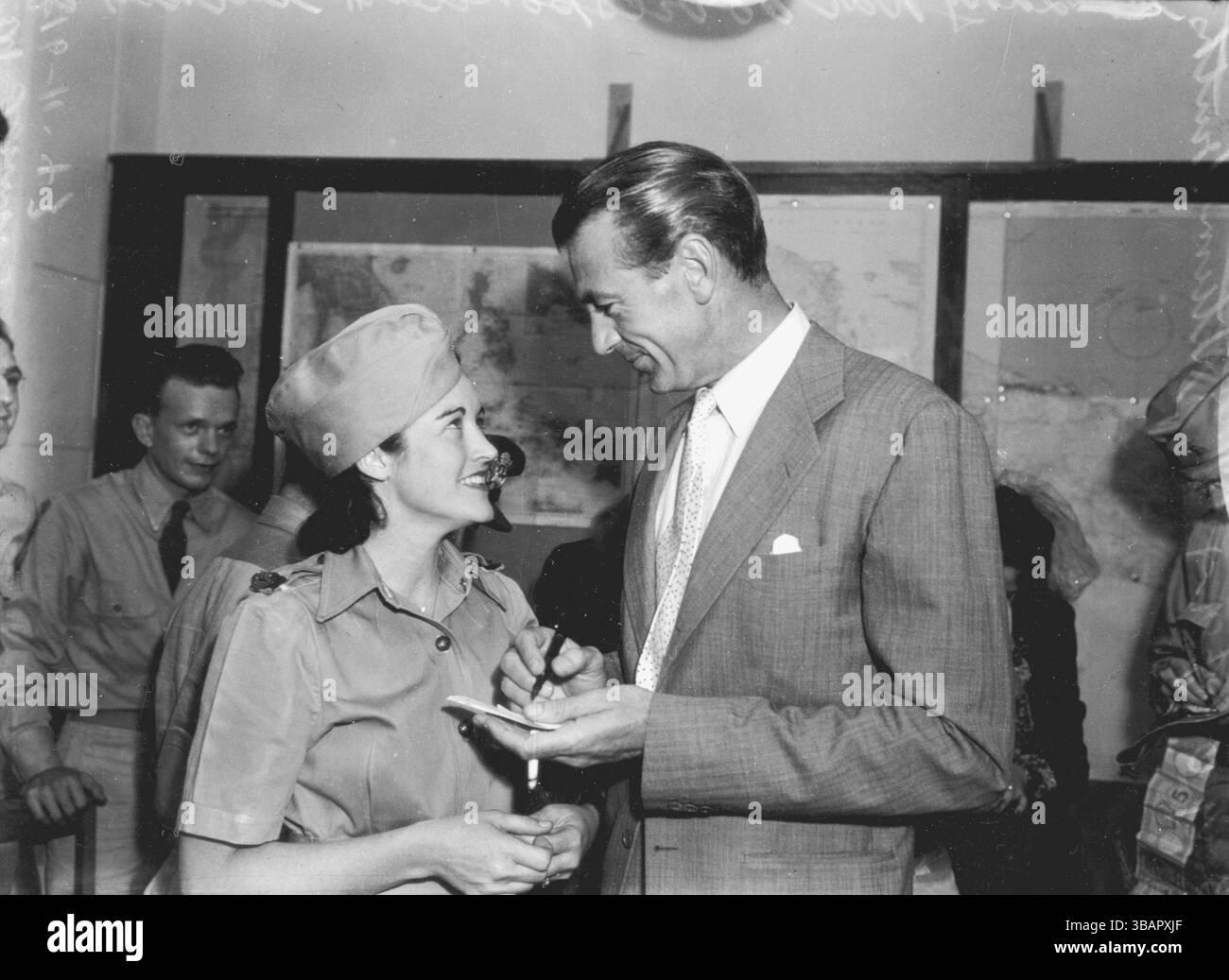 An autograph hunter gets Gary Cooper's autograph during a visit to ...