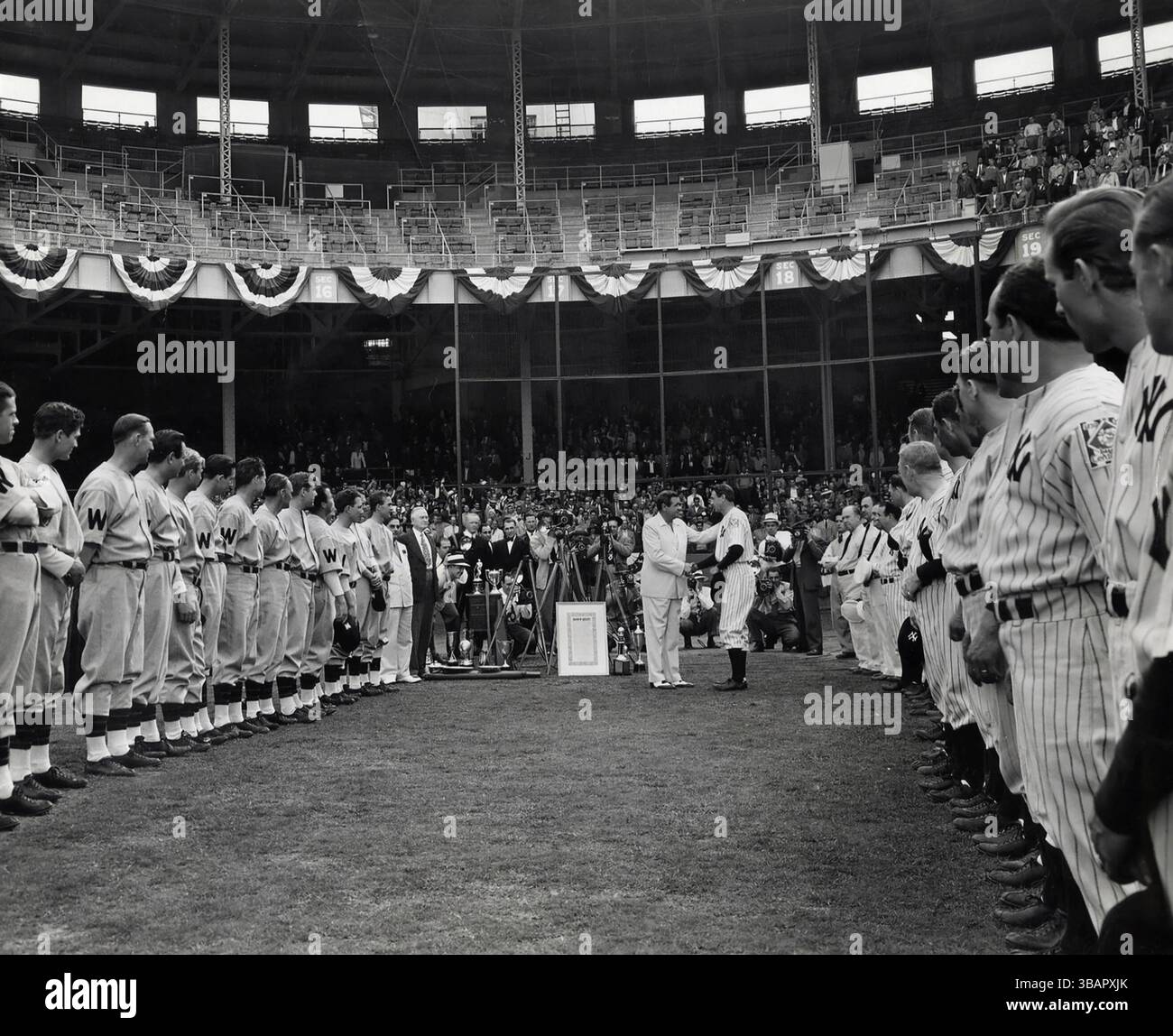 The great Babe Ruth shaking hands with film star Gary Cooper, (playing ...