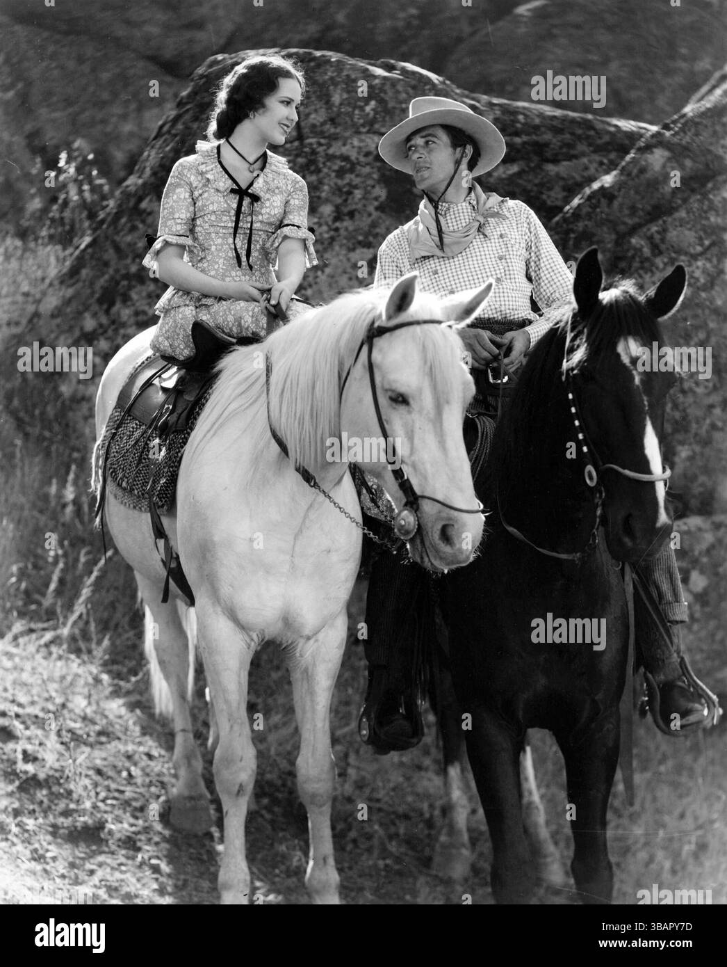 Film star Gary Cooper and Mary Brian in a western movie, The Virginian ...