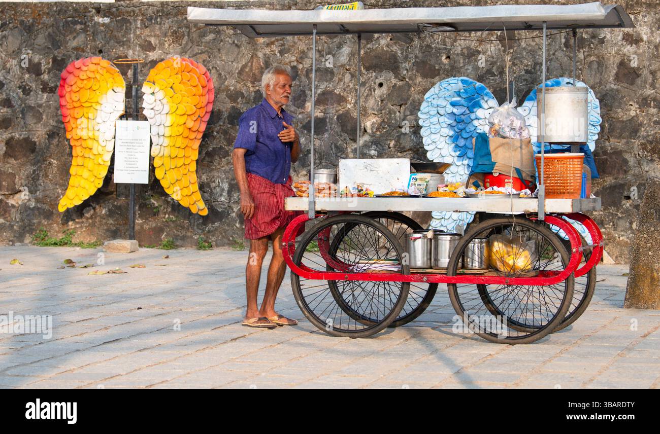 Sale of food and drinksat market stall hand cart on street in India ...