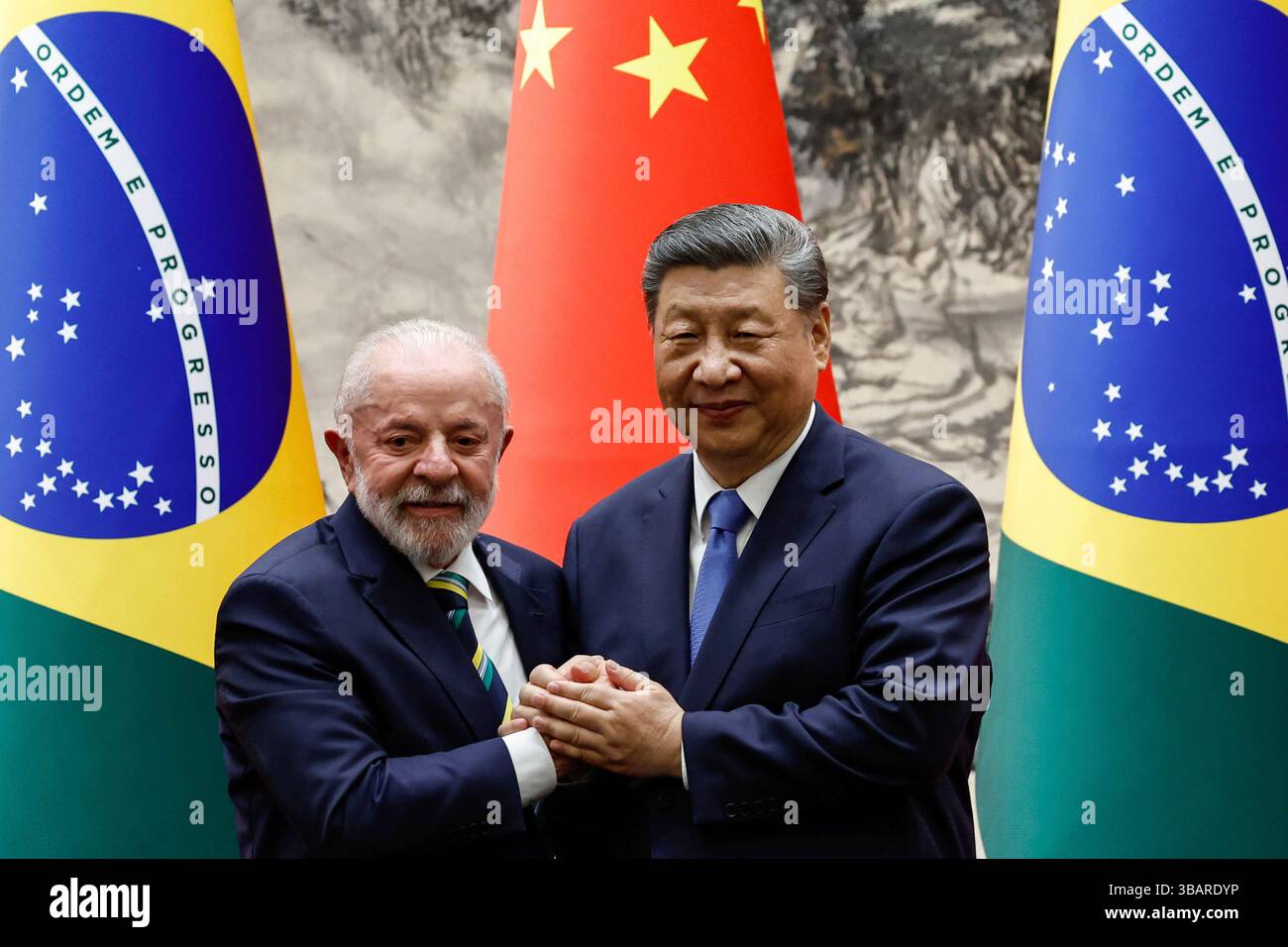 Chinese President Xi Jinping shakes hands with Brazil's President Luiz ...