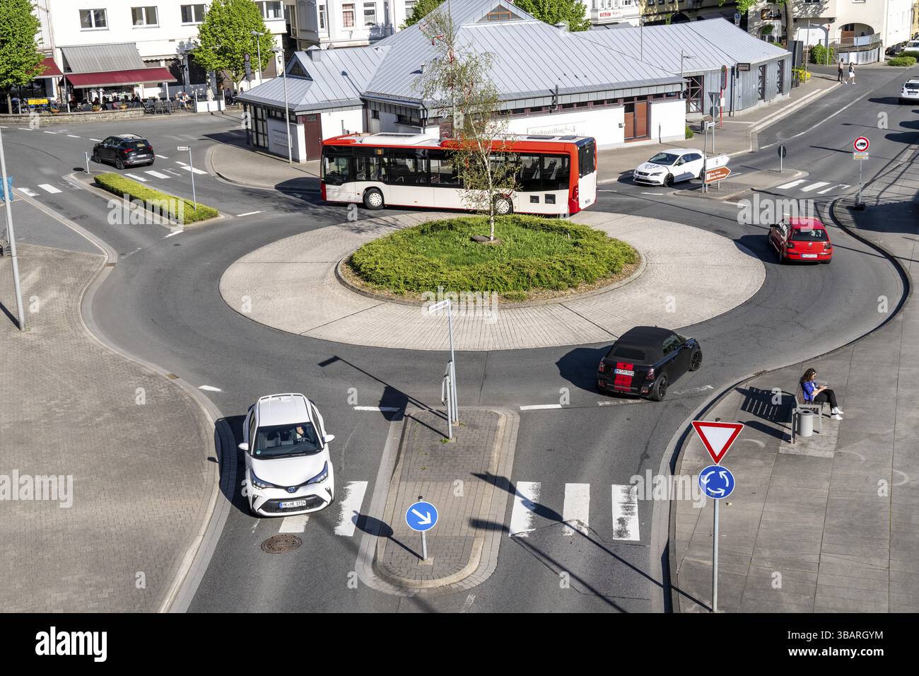 Local bus, vehicles in a roundabout, city centre, Altena, North Rhine ...