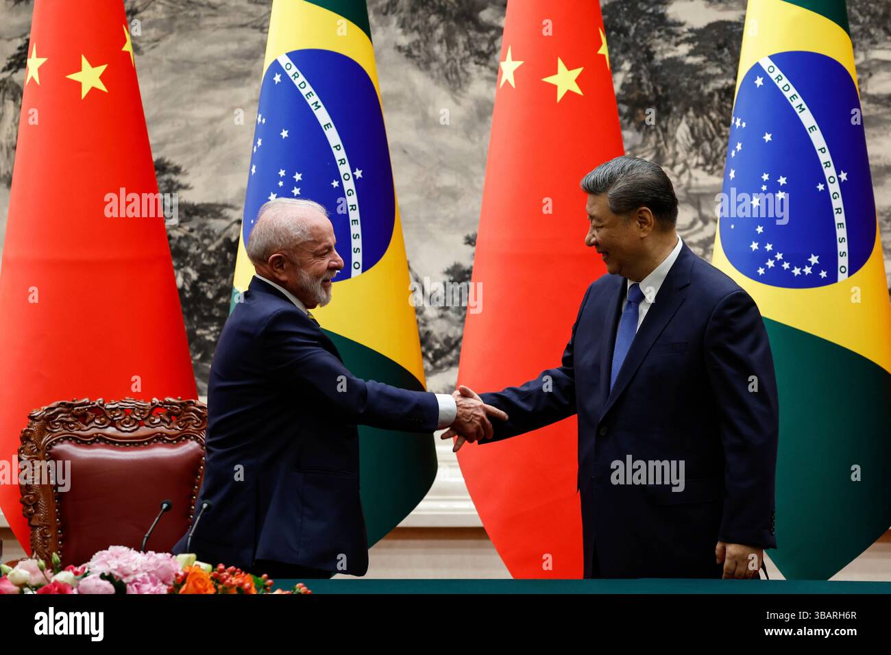Chinese President Xi Jinping shakes hands with Brazil's President Luiz ...