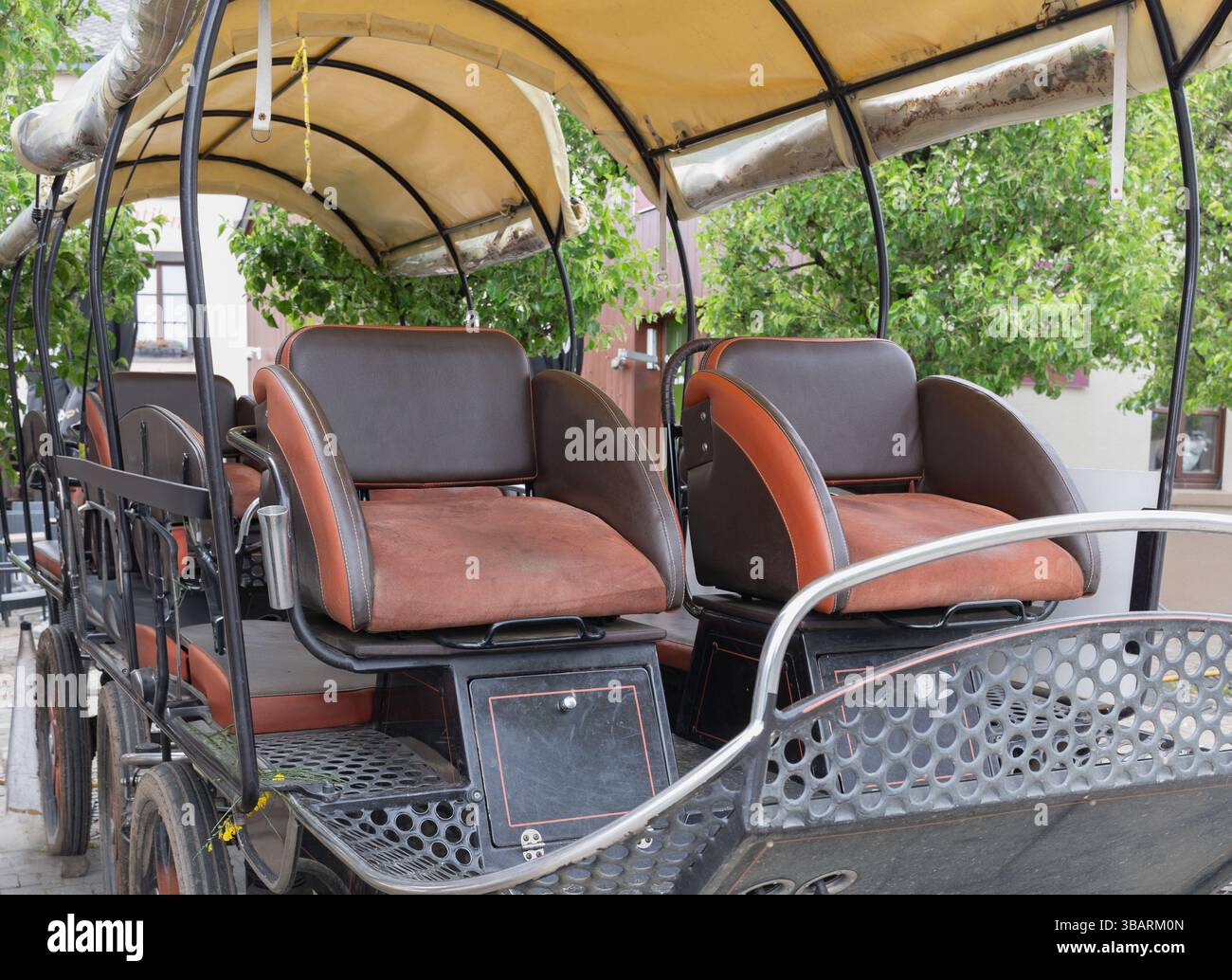 A classic carriage with two seats and a shade canopy Stock Photo - Alamy