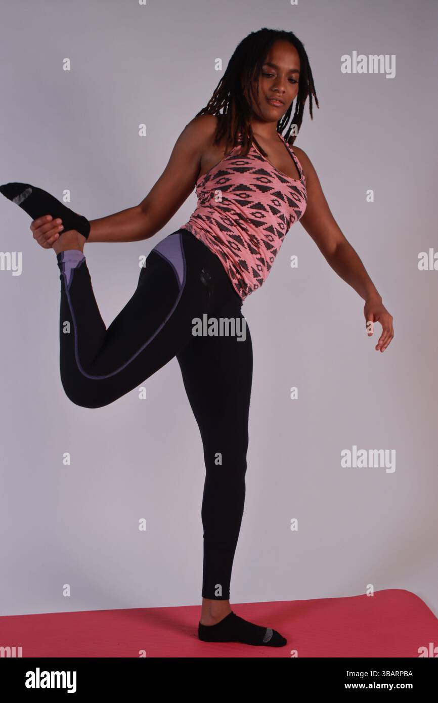 Black woman of Afro-Caribbean descent with dreadlocks wearing fitness ...