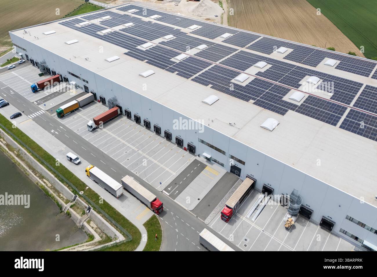Logistics centers with solar panels on roofs. Aerial view Stock Photo ...