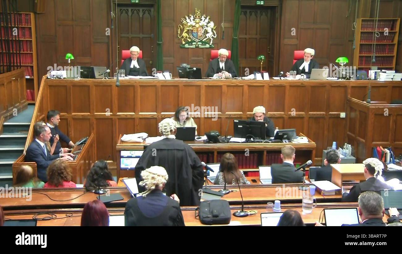Screen grab taken from PA Video of (left to right) Mr Justice Goss ...