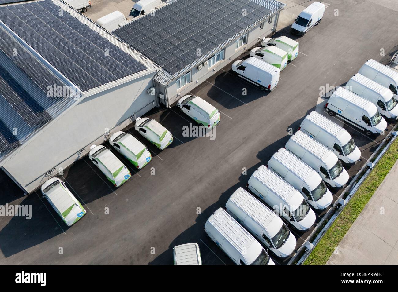 Electric delivery vans hub. Fleet of electric vehicles Stock Photo - Alamy