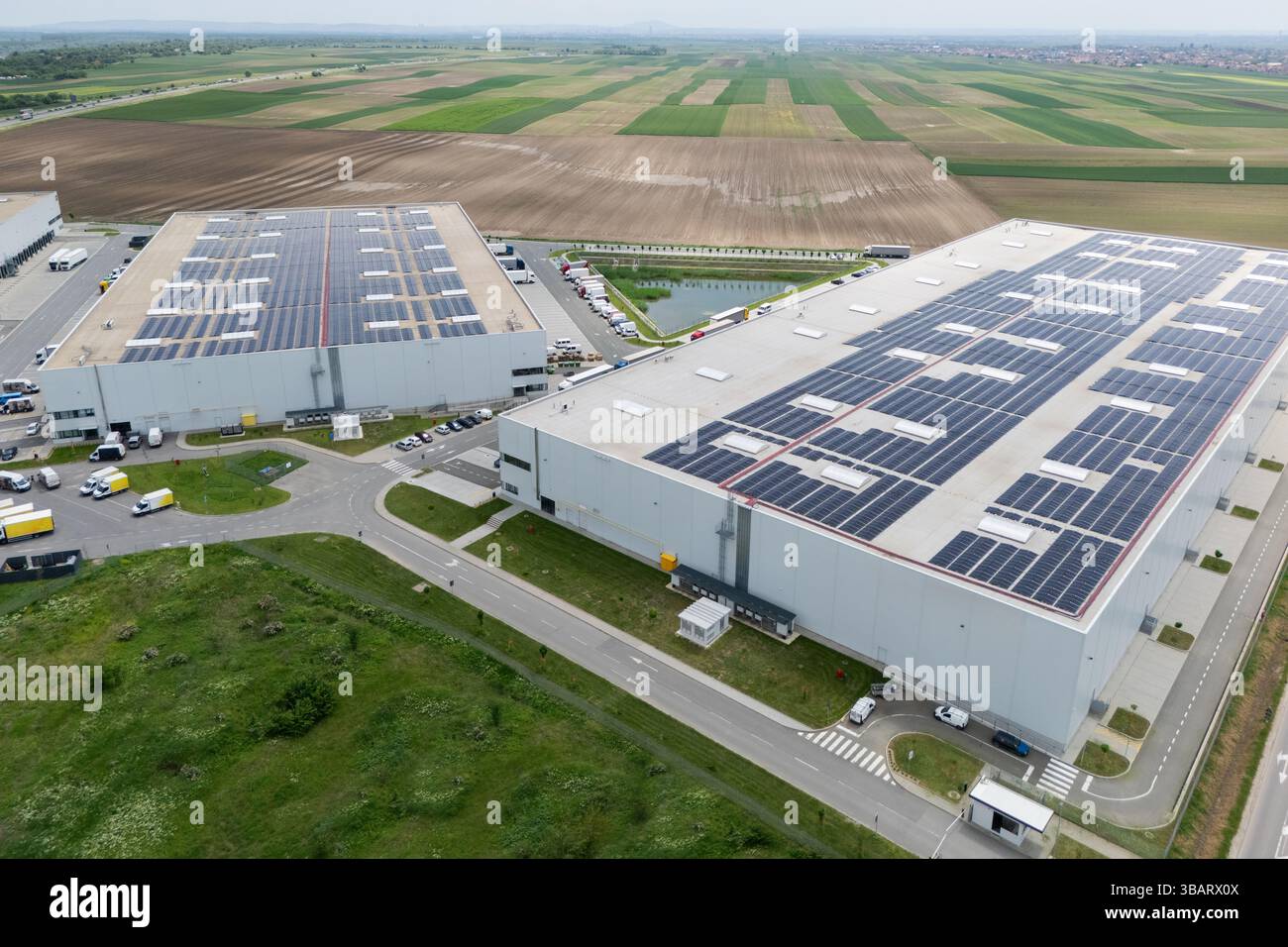 Logistics centers with solar panels on roofs. Aerial view Stock Photo ...