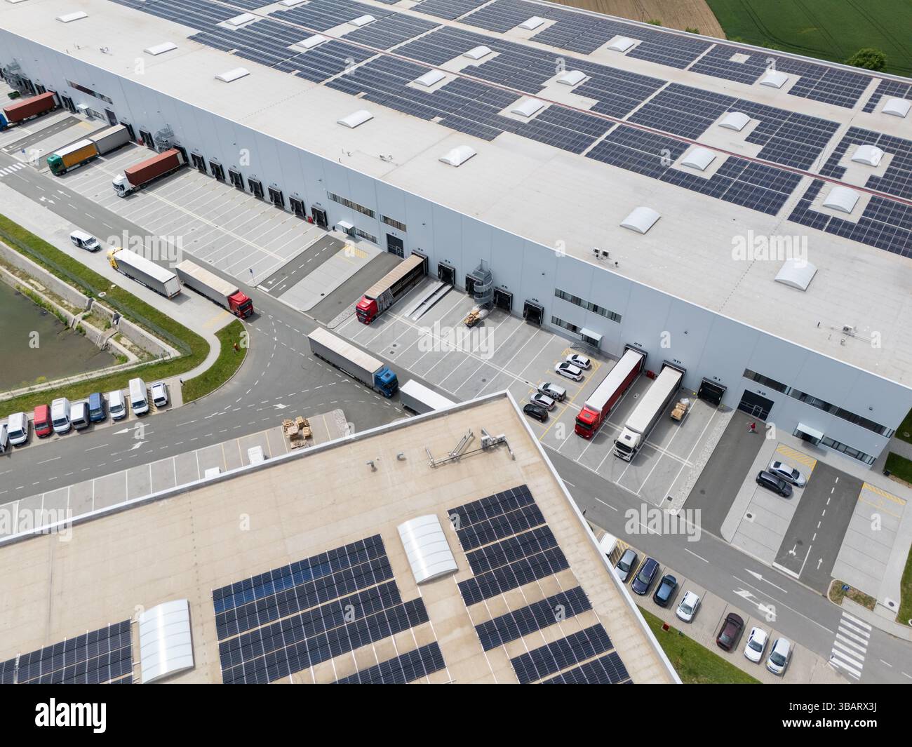 Logistics centers with solar panels on roofs. Aerial view Stock Photo ...
