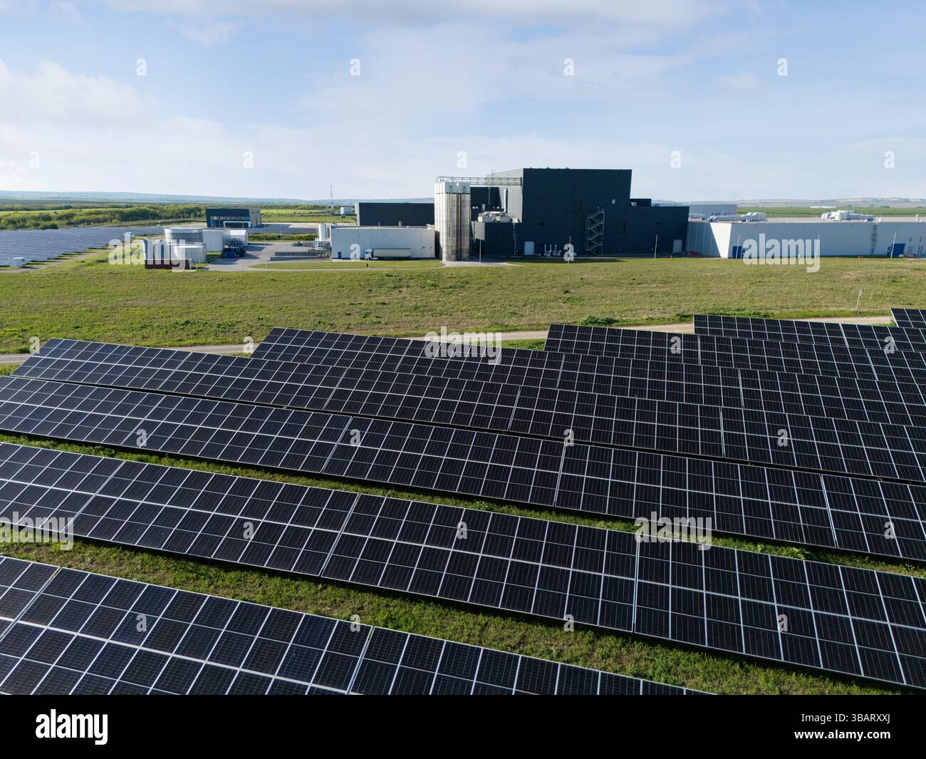 Modern green factory powered by renewable solar energy. Sustainable ...