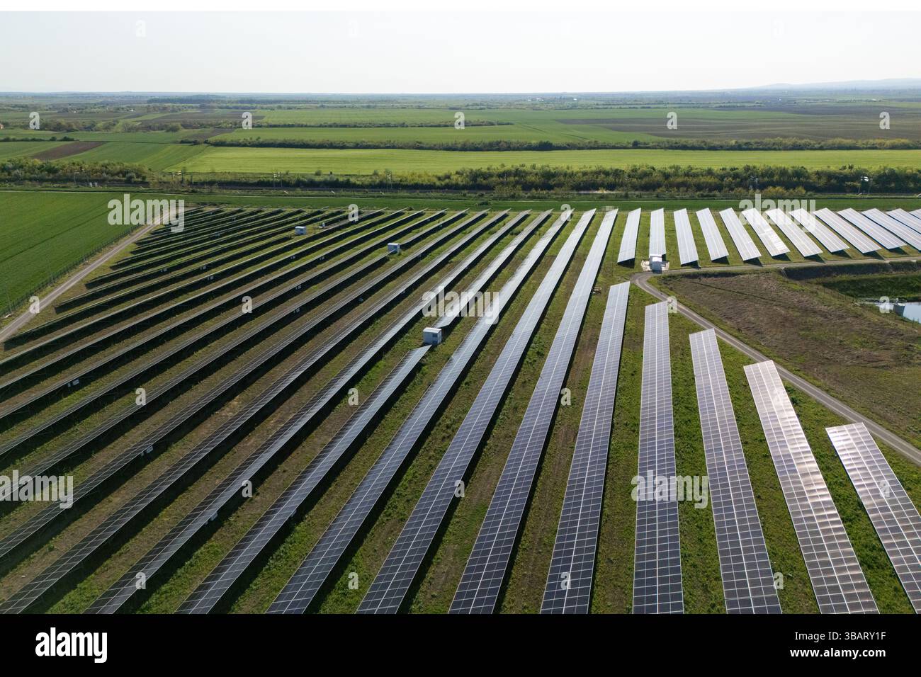 Aerial view of solar power station and green agricultural field ...