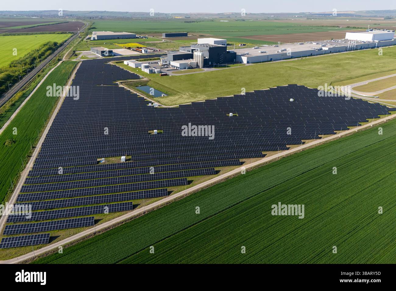 Modern green factory powered by renewable solar energy. Sustainable ...