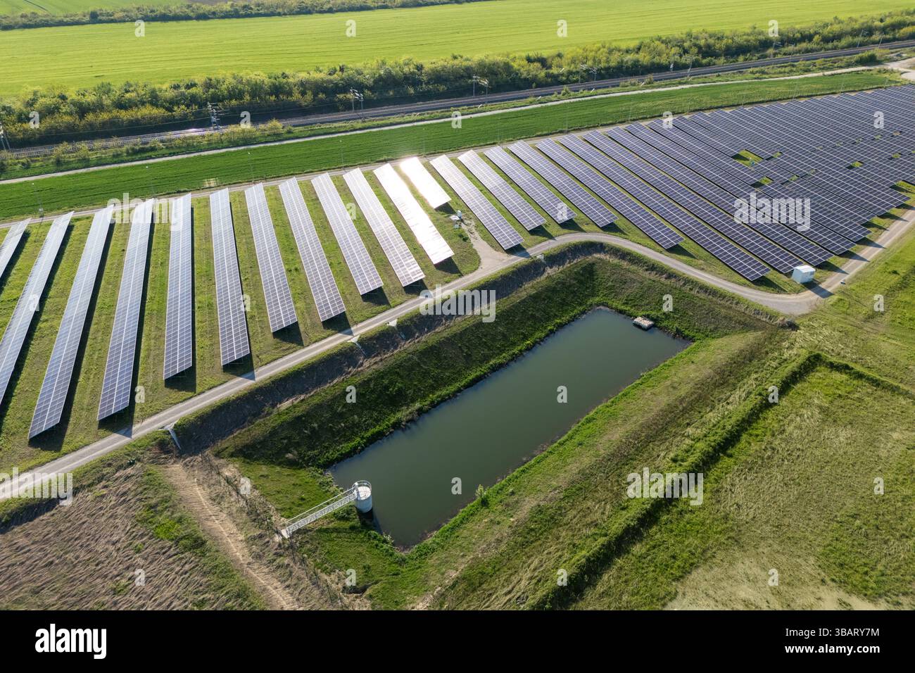 Aerial view of solar power station and green agricultural field ...