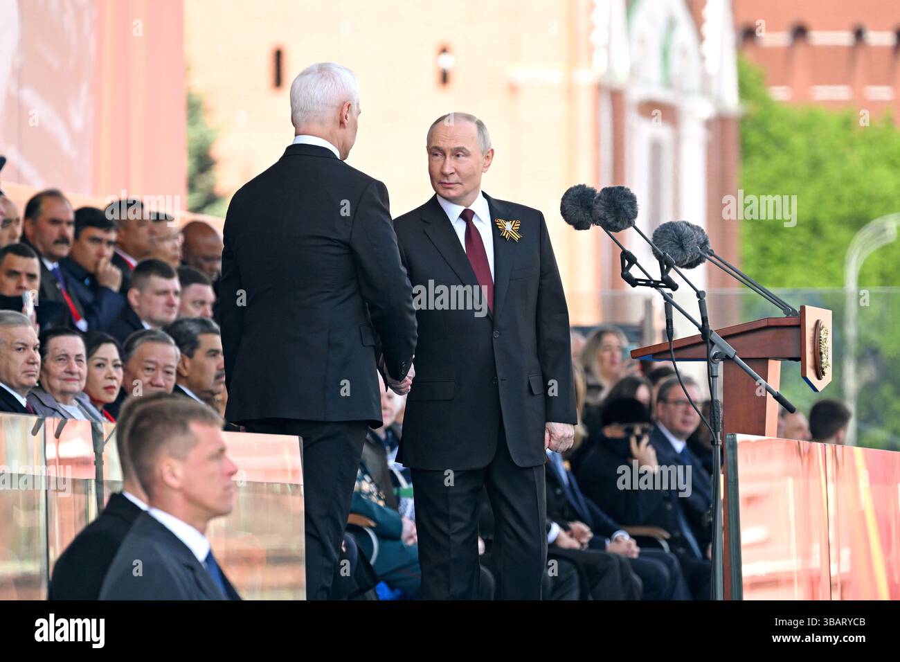 Russian President Vladimir Putin (right) and Russian Defense Minister Andrei Belousov (center ...