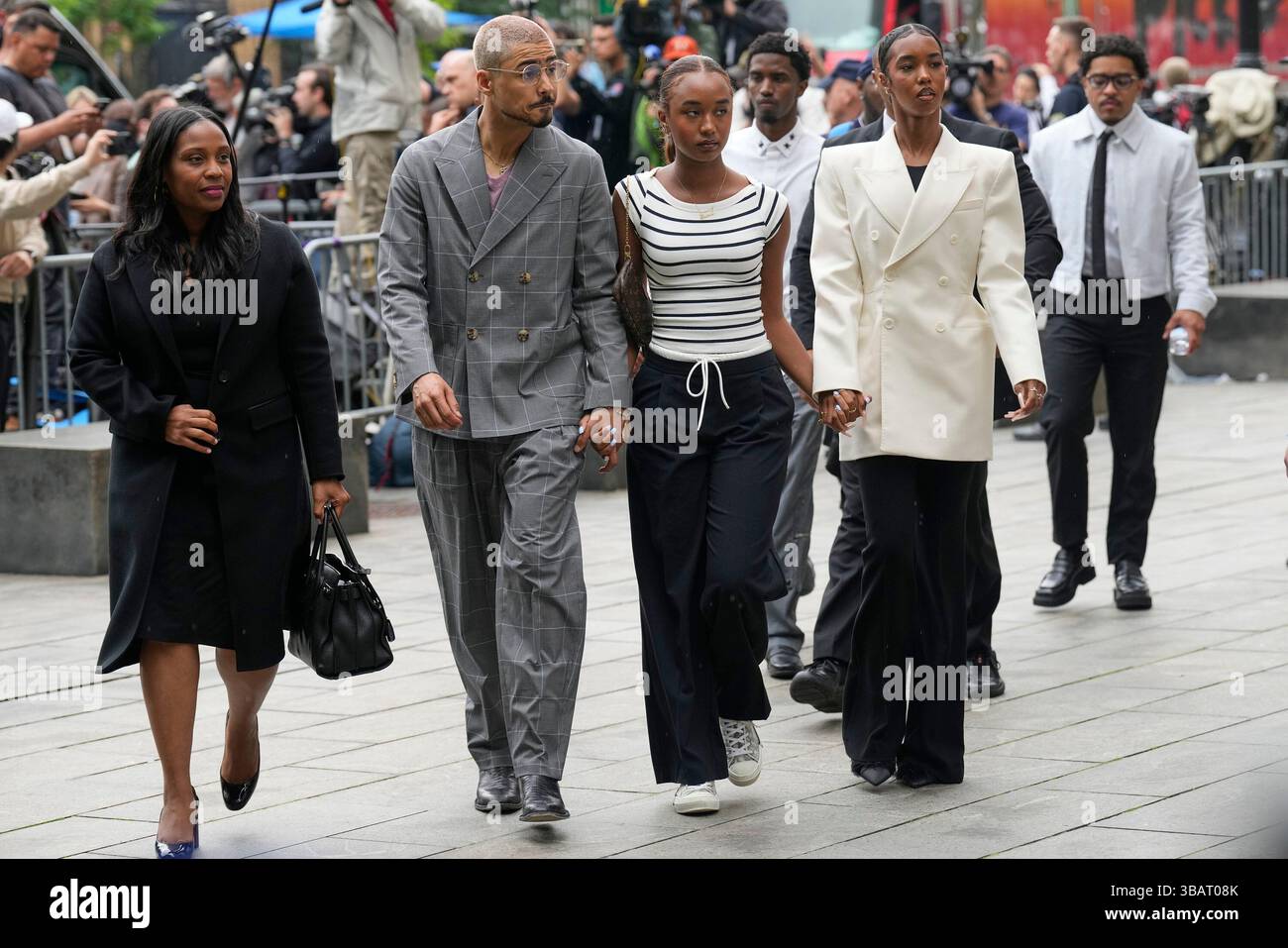 Quincy Combs, second from left, and Chance Combs center, arrive at ...