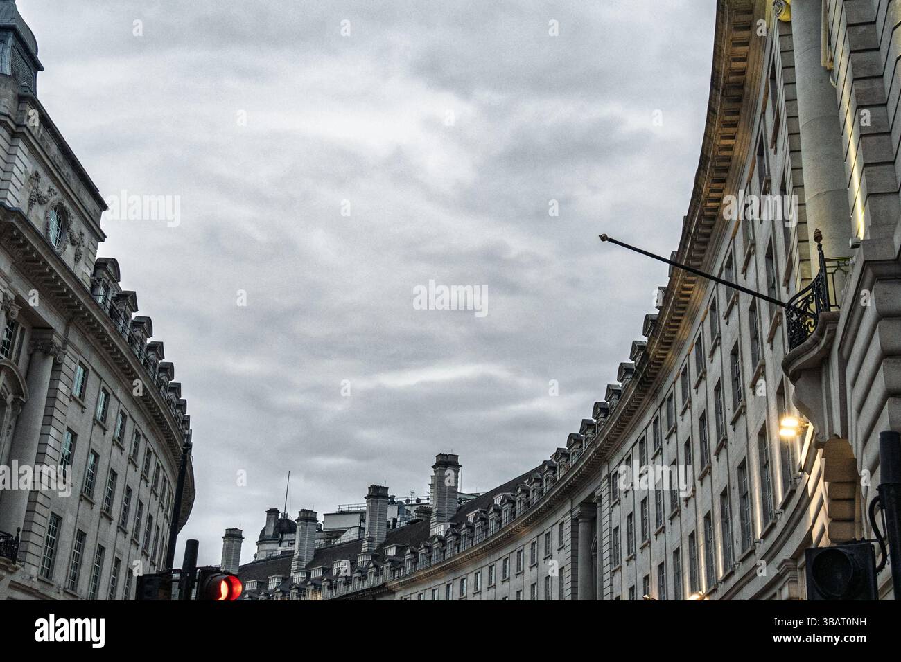 Regent street buildings reaching for cloudy sky in london Stock Photo ...
