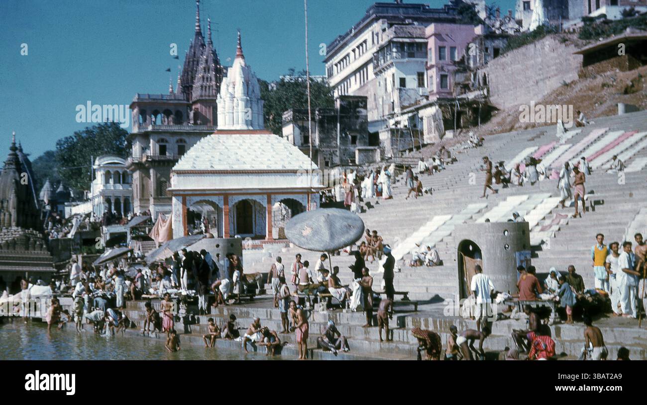 1960s, historical, people at a ghat - riverside steps - on the ...