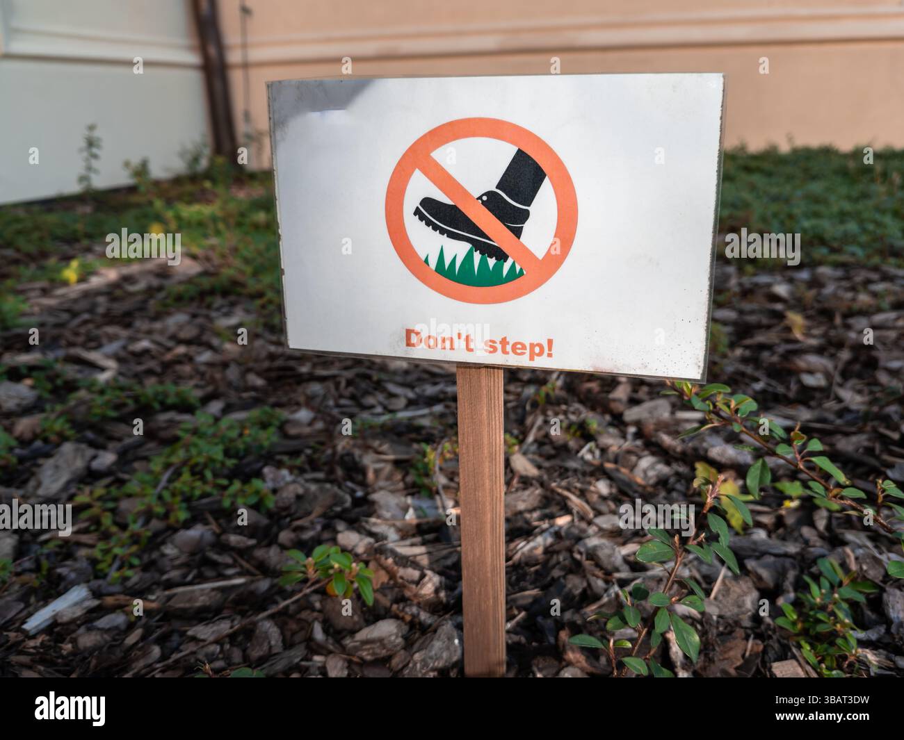 Don't step sign protecting fragile plants in garden Stock Photo - Alamy