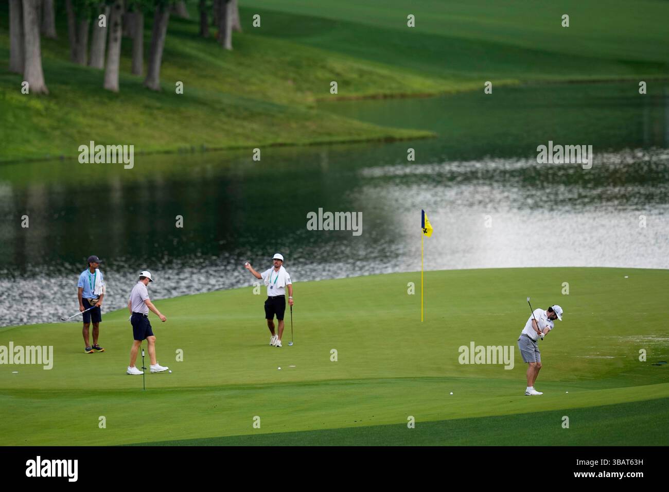 Adam Hadwin, of Canada, chips to the green on the 14th hole during a ...