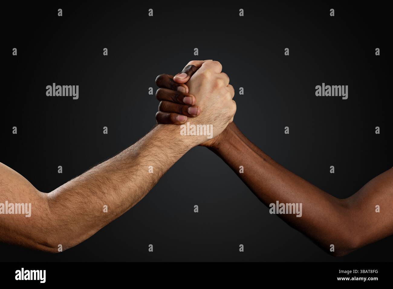 Black and white human hands shake on black background. Handshake ...