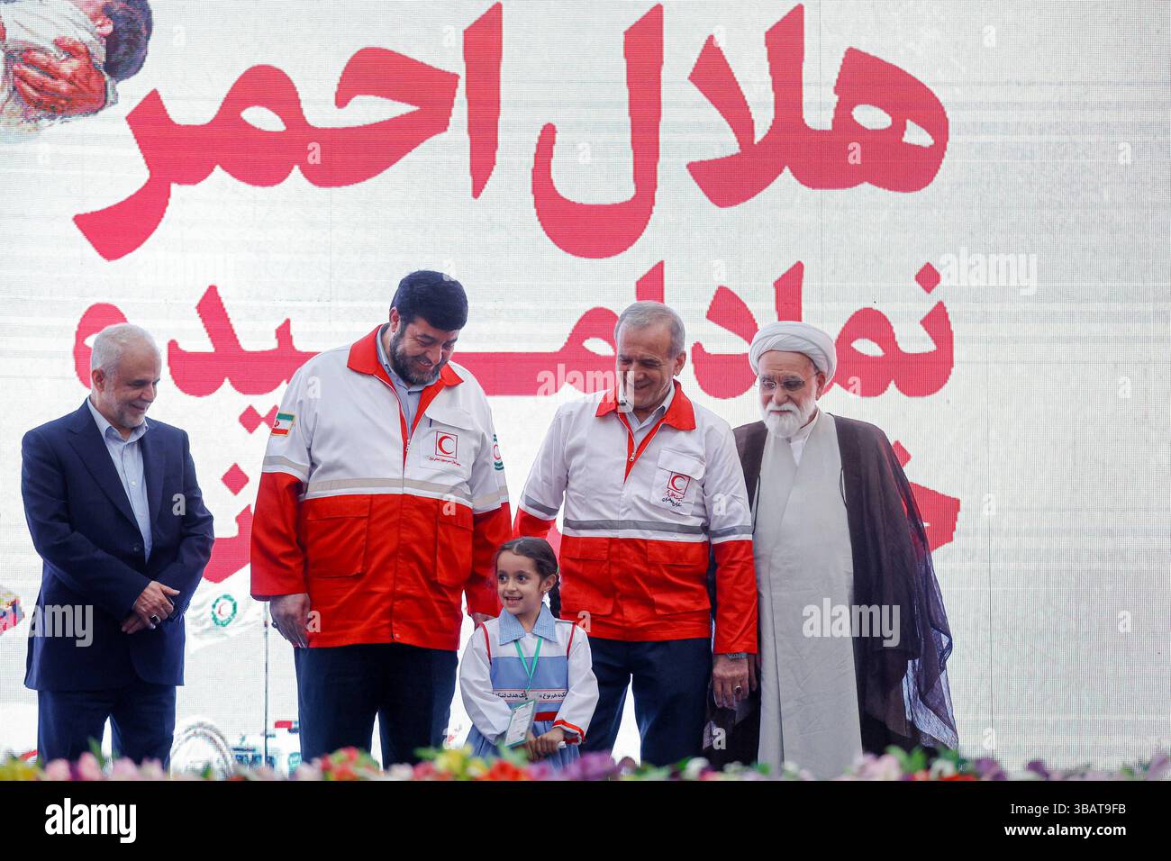 Iranian President Masoud Pezeshkian attends a conference marking the ...