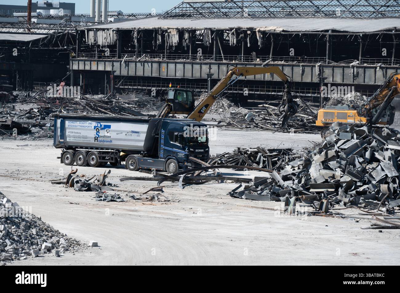 Demolition excavators at work, demolition work on the former continuous ...