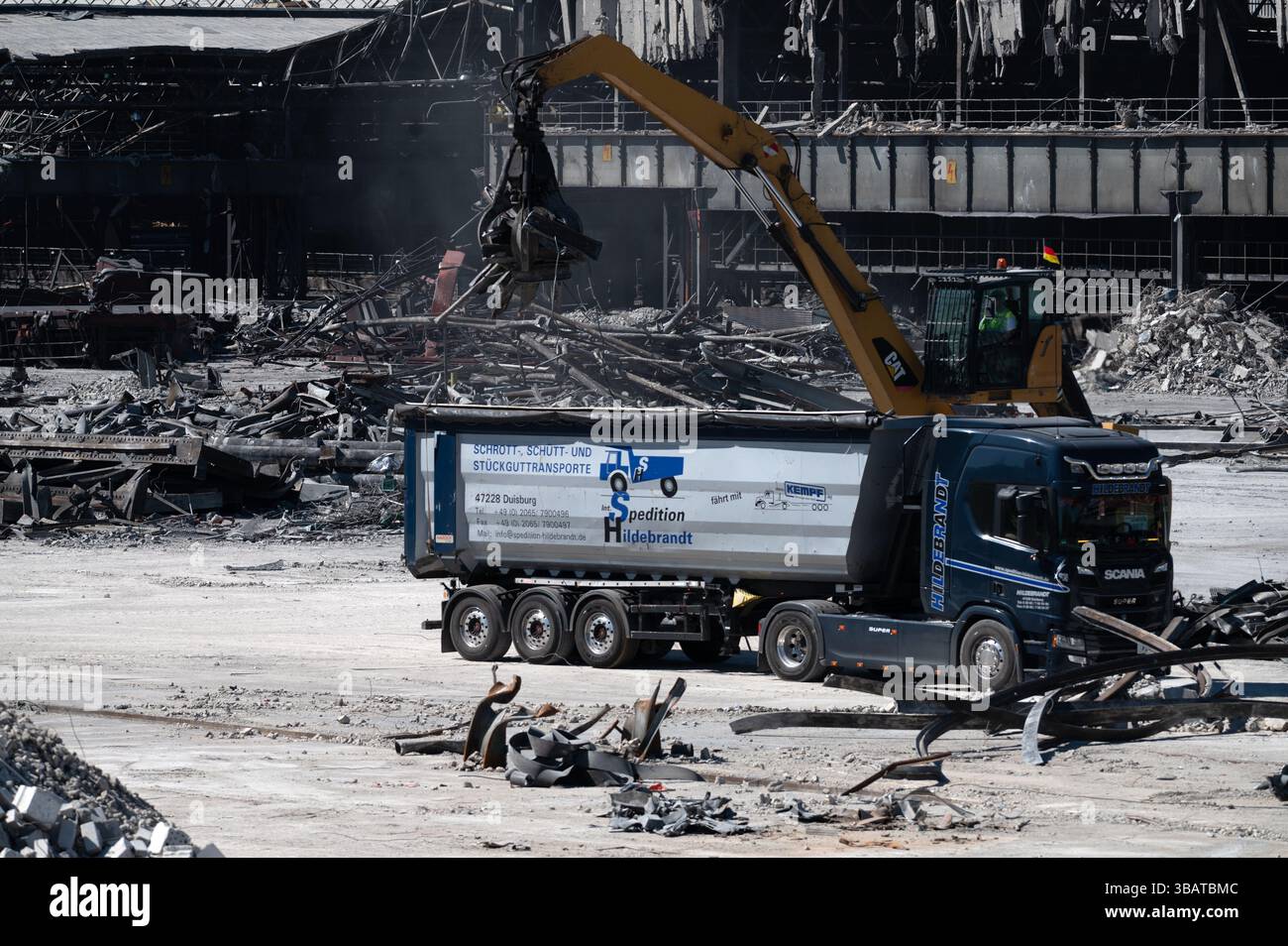 Demolition excavators at work, demolition work on the former continuous ...