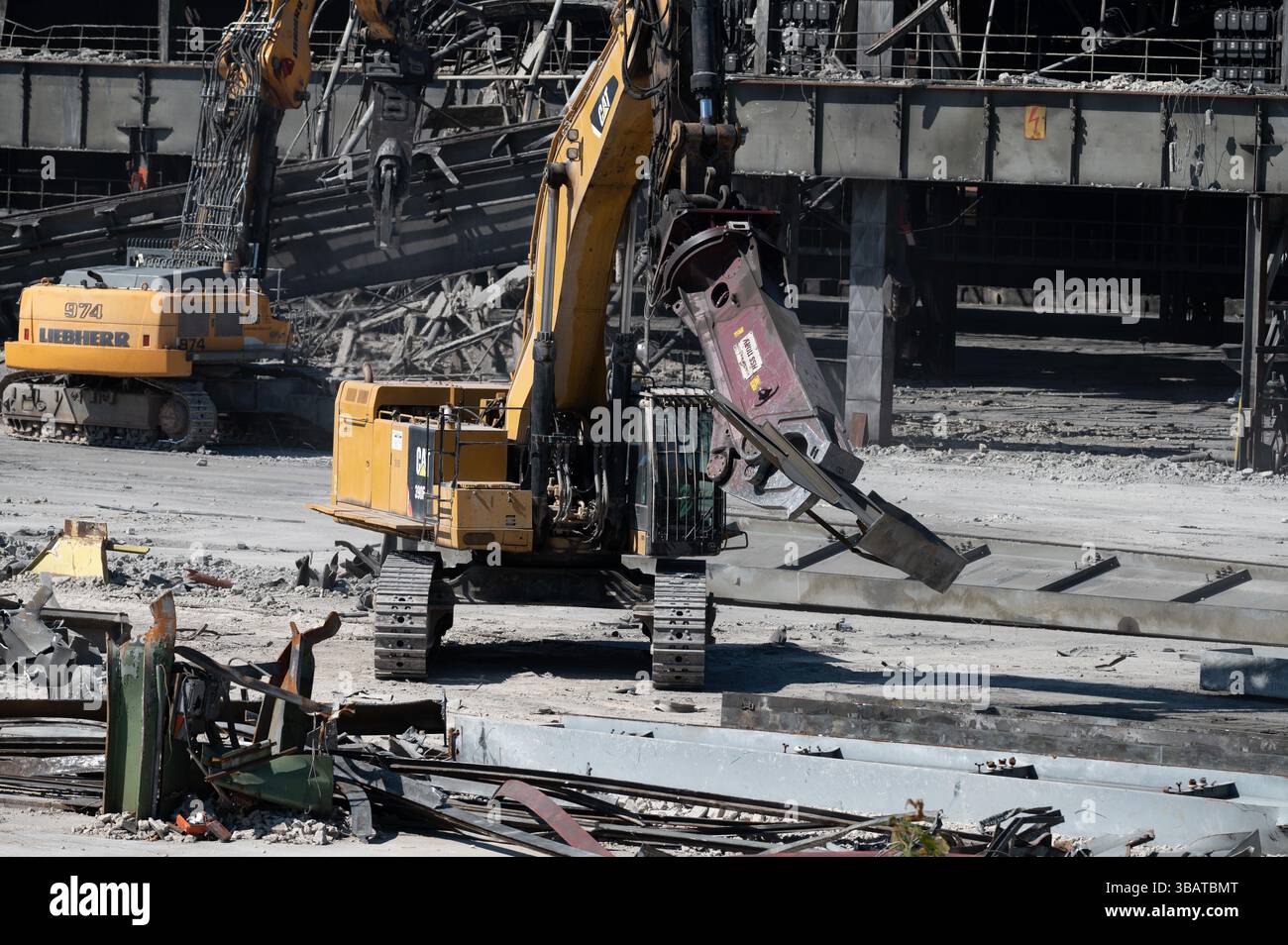 Demolition excavators at work, demolition work on the former continuous ...