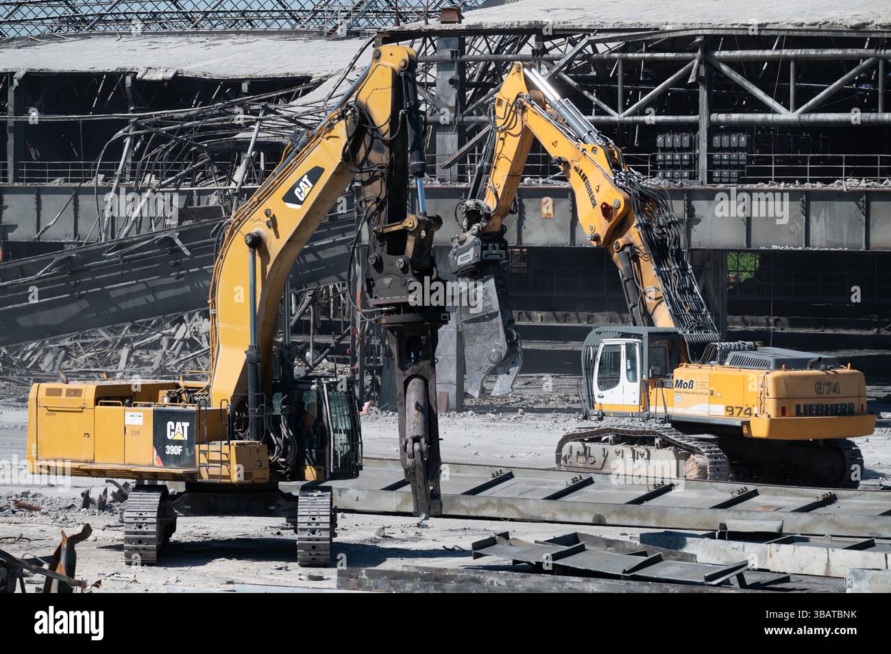 Demolition excavators at work, demolition work on the former continuous ...