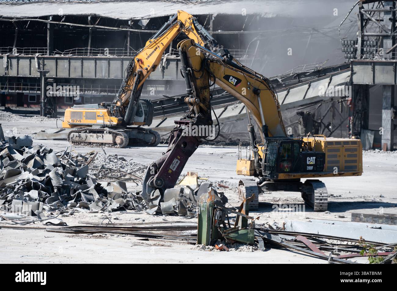Demolition excavators at work, demolition work on the former continuous ...