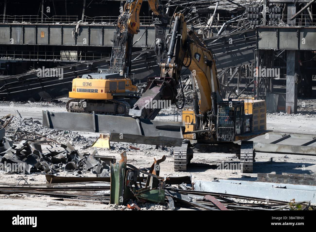 Demolition excavators at work, demolition work on the former continuous ...