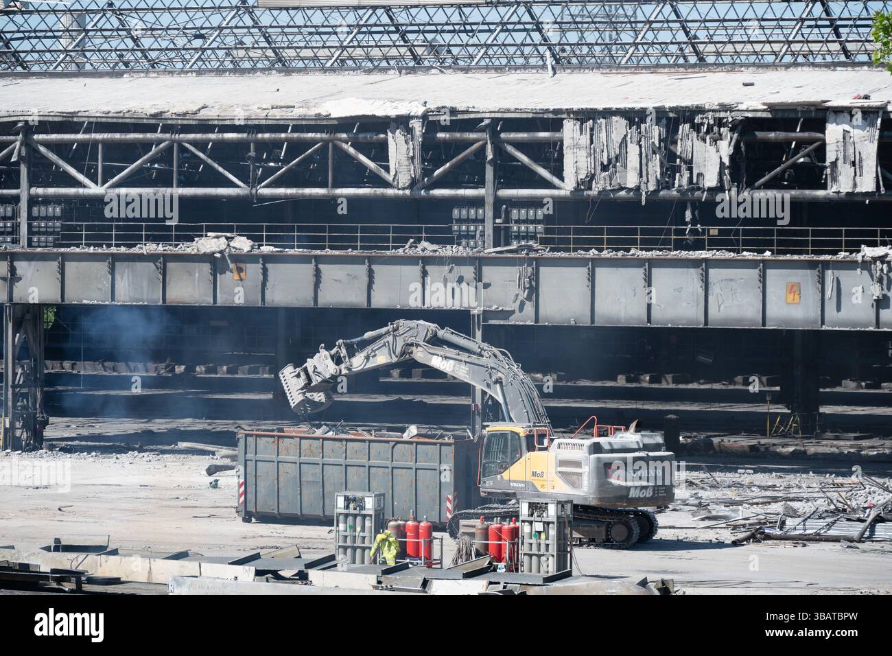 Demolition excavators at work, demolition work on the former continuous ...