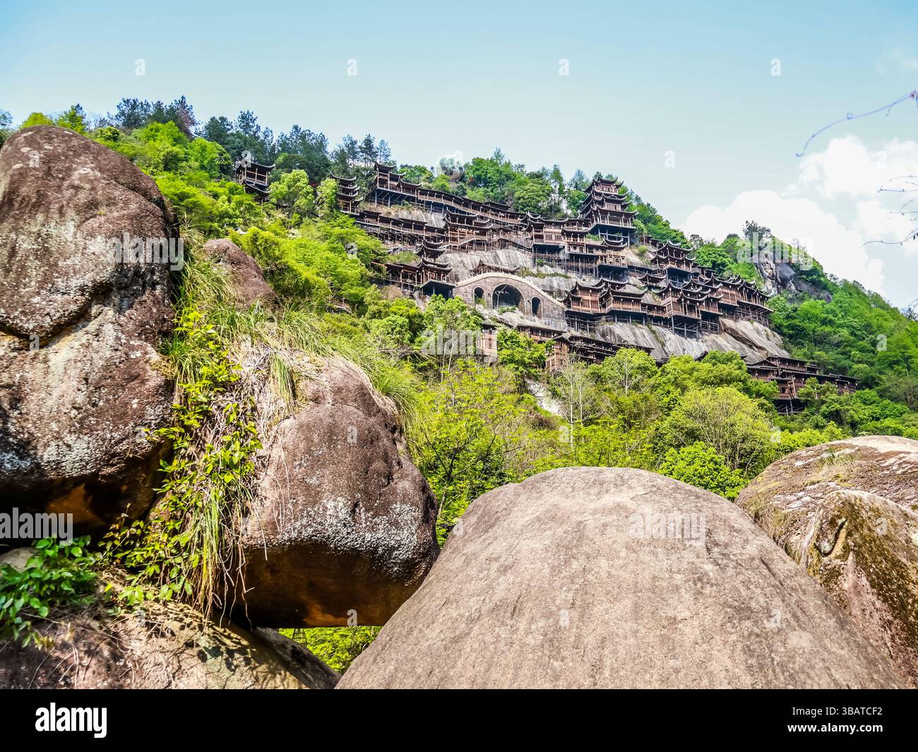 Traditional Chinese cliffside architecture at Wangxian Valley Town ...