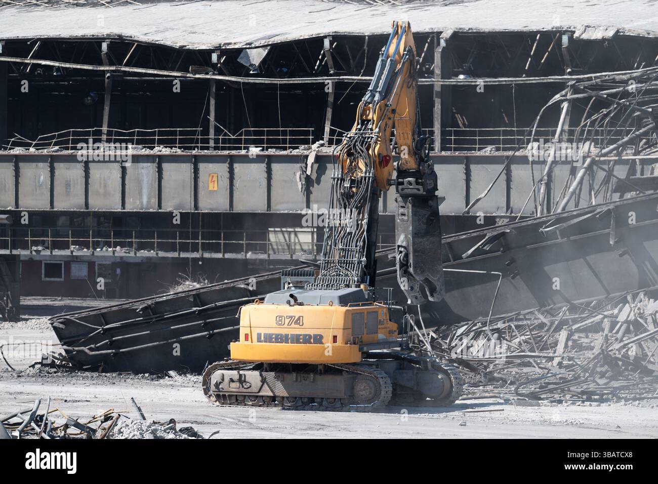 Demolition excavators at work, demolition work on the former continuous ...