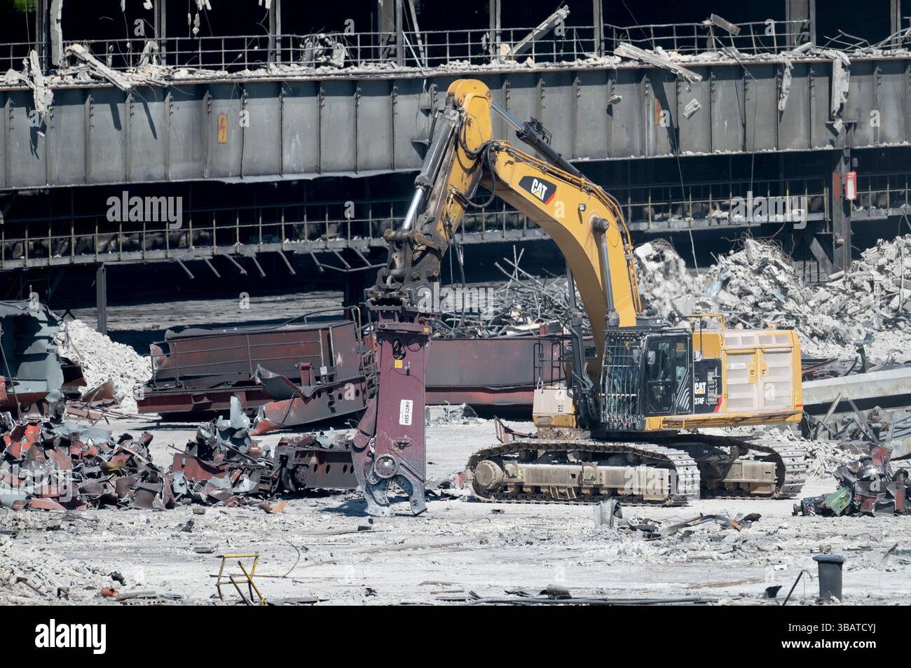 Demolition excavators at work, demolition work on the former continuous ...