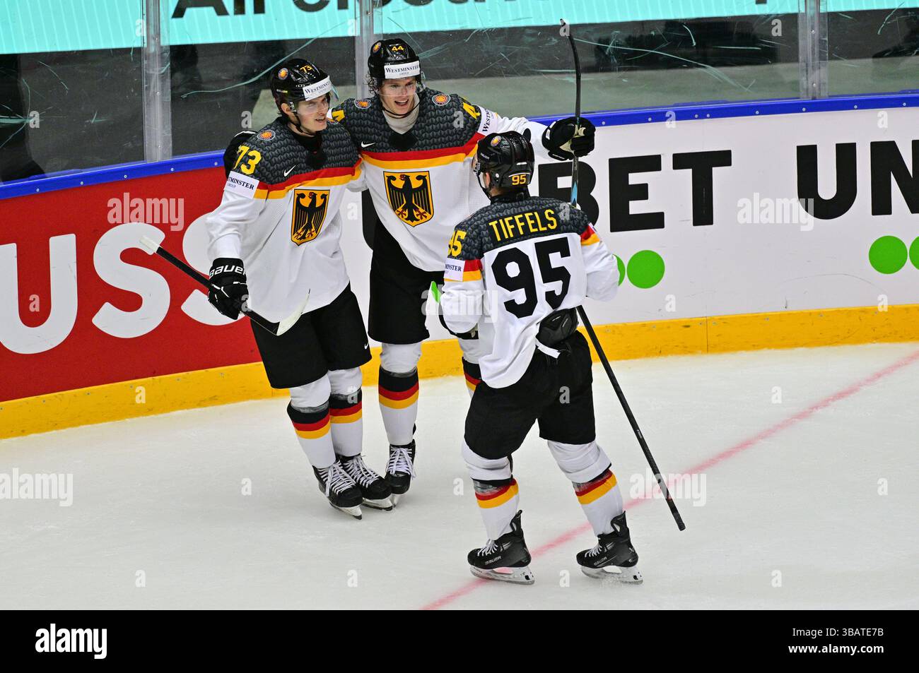 Joshua Samanski (GER, middle) celebrates his goal during the Group B ...
