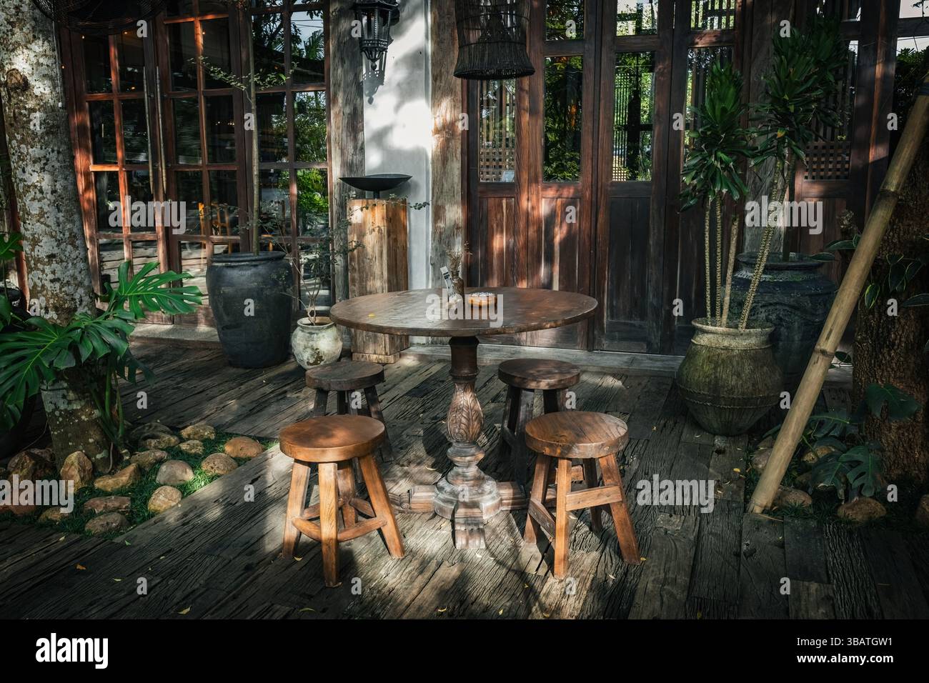 Rustic outdoor seating area of a traditional wooden café in Bali ...