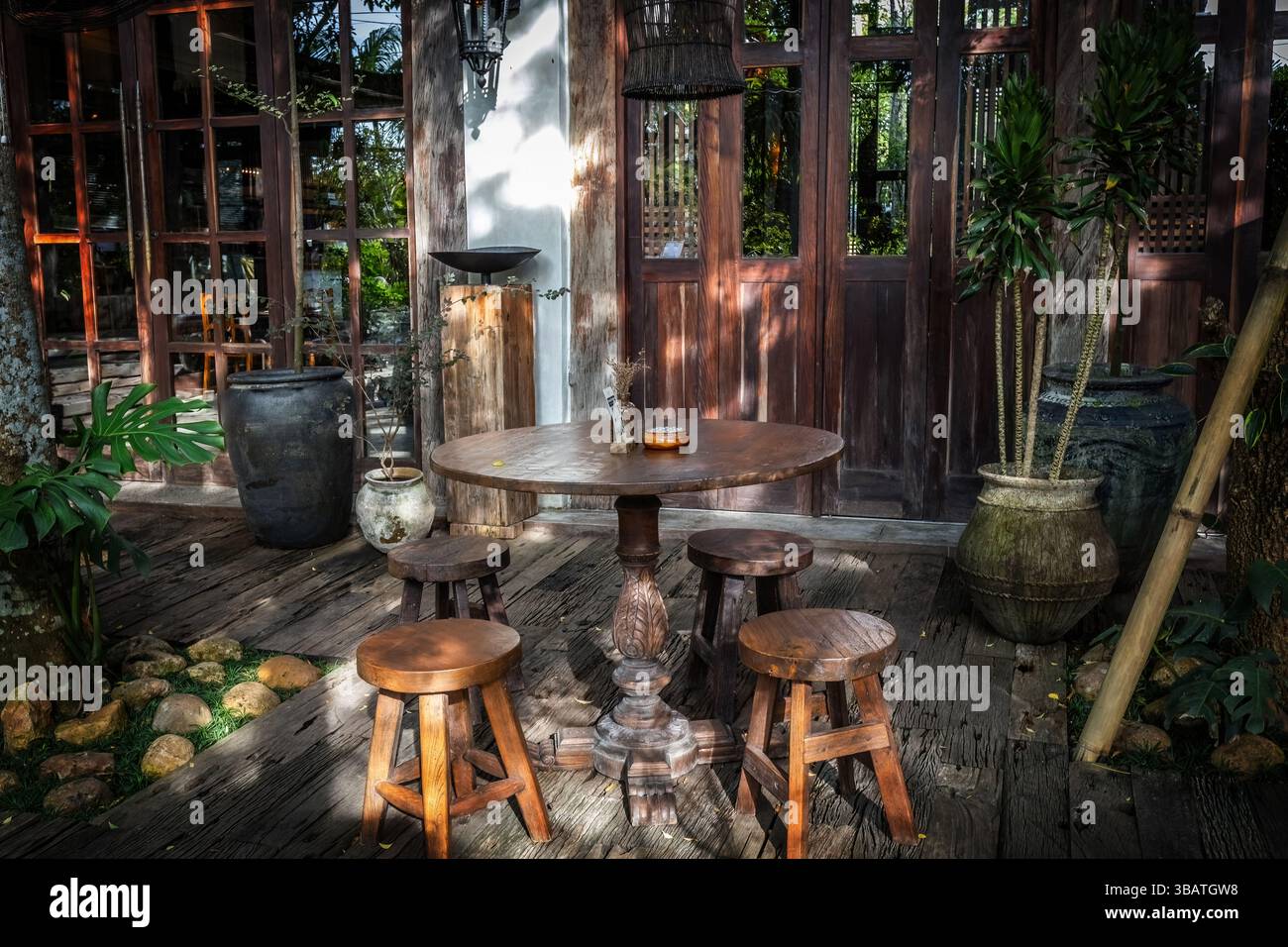 Rustic outdoor seating area of a traditional wooden café in Bali ...