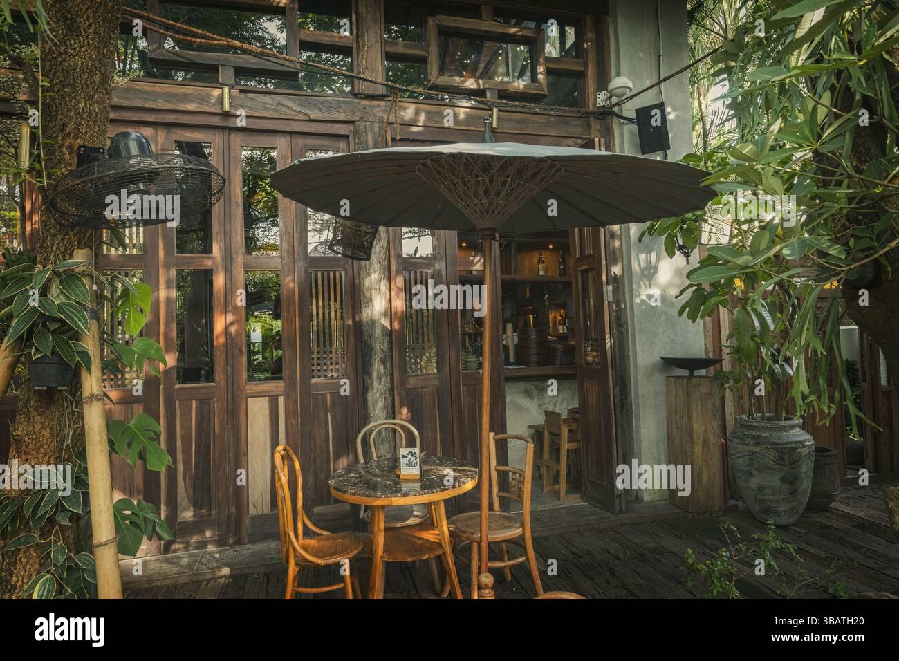 Rustic outdoor seating area of a traditional wooden café in Bali ...