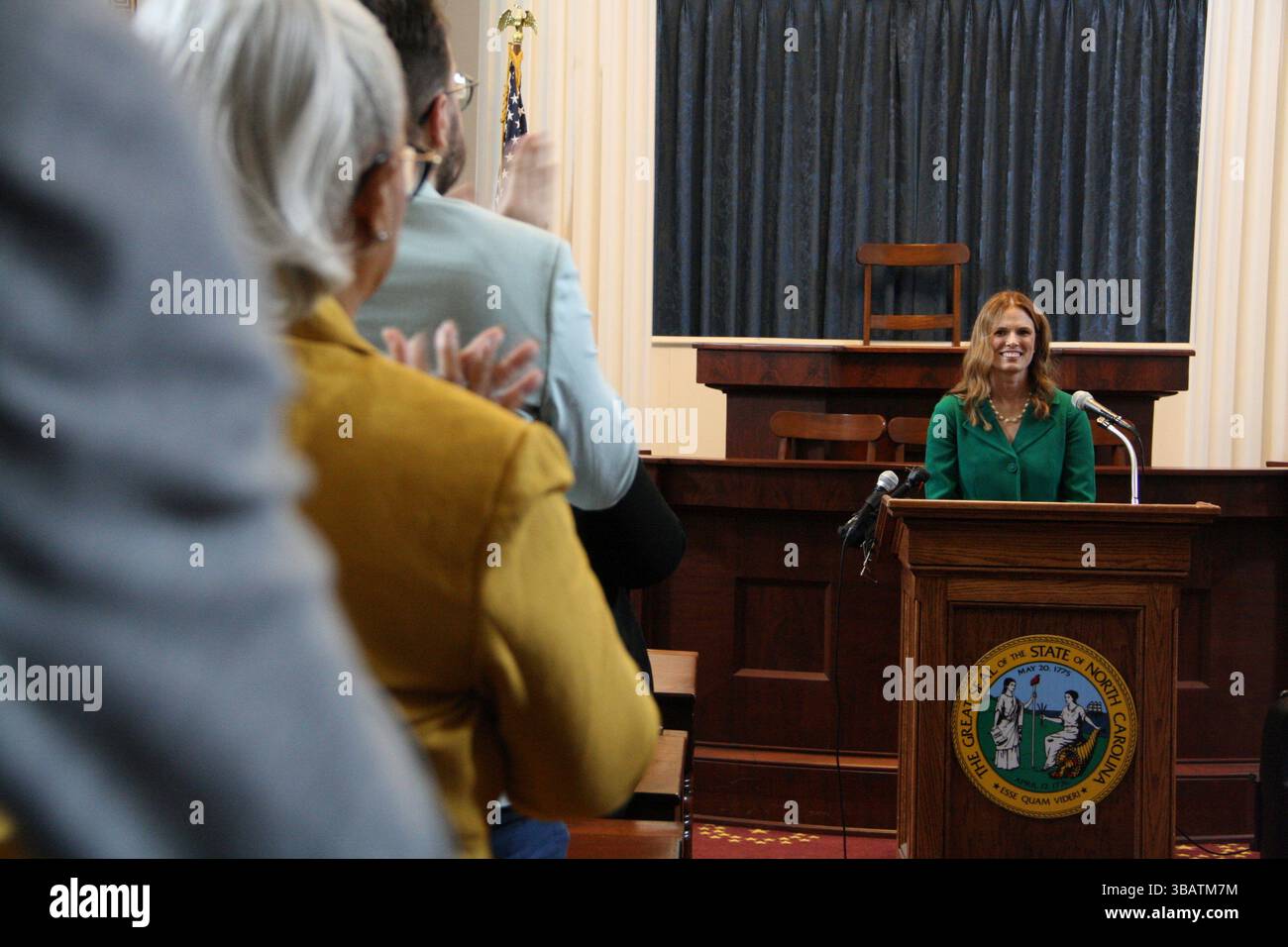 Allison Riggs smiles as audience members clap during her state Supreme ...