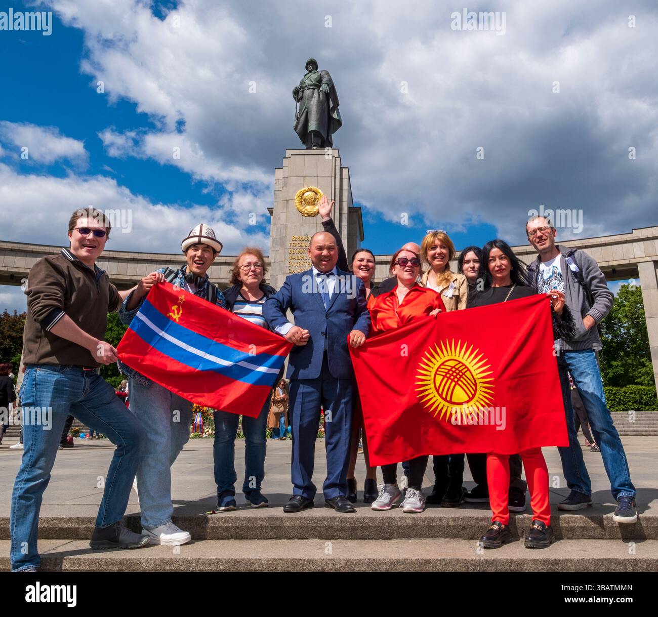 People holding the flags of Kyrgyzstan and of the Kyrgyz Soviet Socialist Republic at the Soviet ...