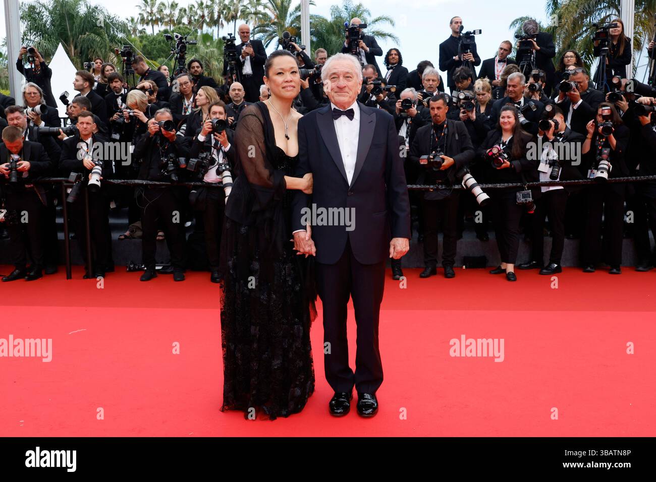 Tiffany Chen, left, and Robert De Niro pose for photographers during ...