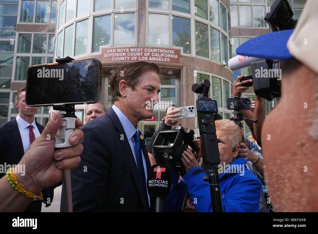 Los Angeles County District Attorney Nathan Hochman is surrounded by ...