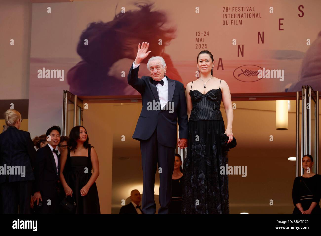Robert De Niro, left, and Tiffany Chen pose for photographers during the opening ceremony red ...
