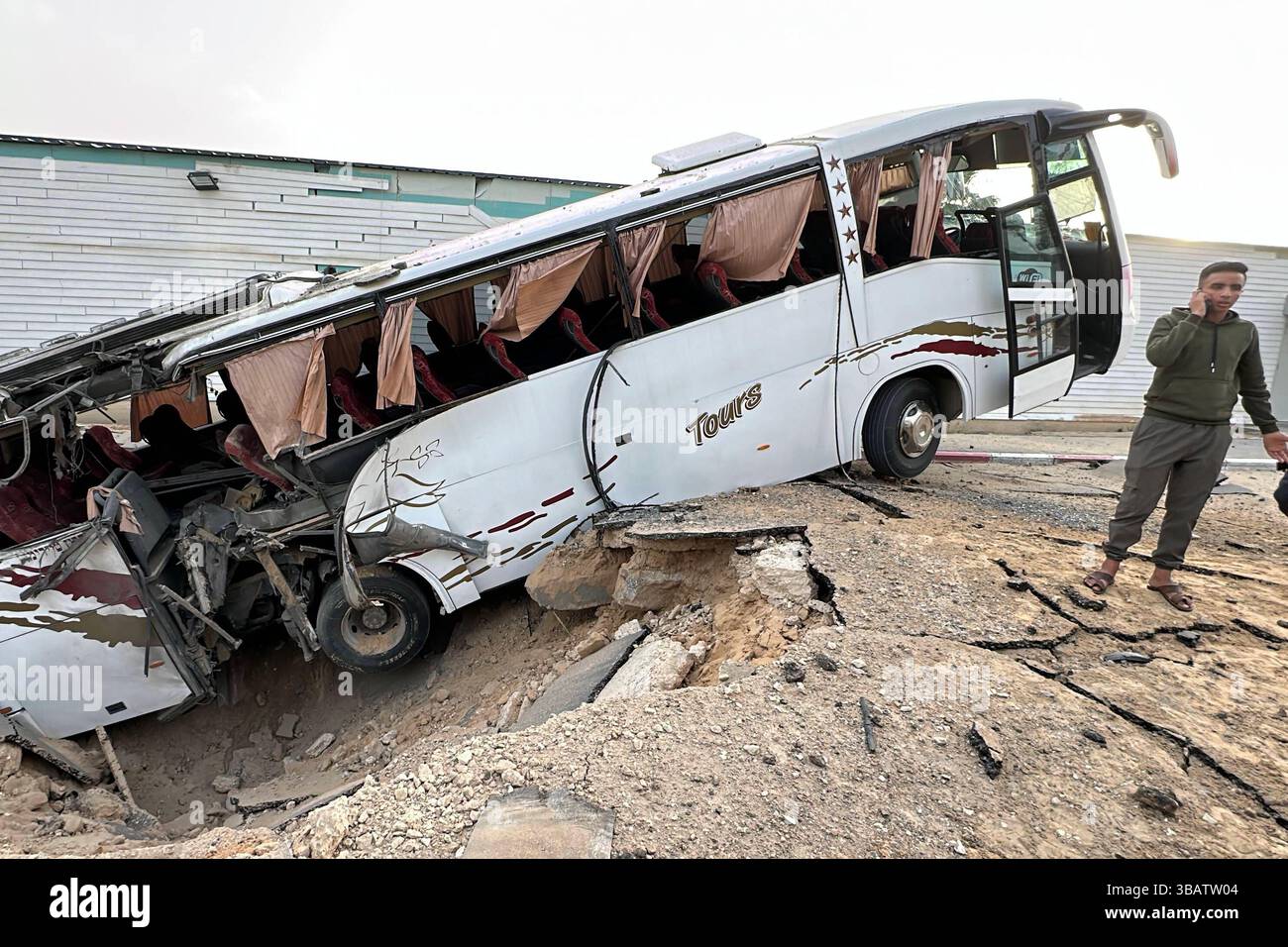 Palestinians inspect the damage, after the European Hospital was ...