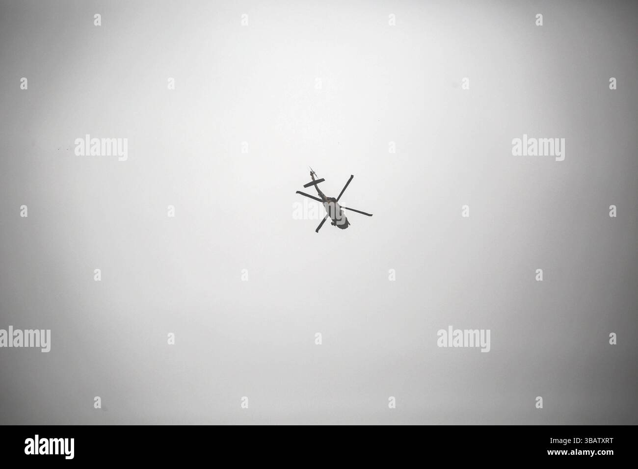 An Israeli military helicopter flies over the Askar refugee camp east ...