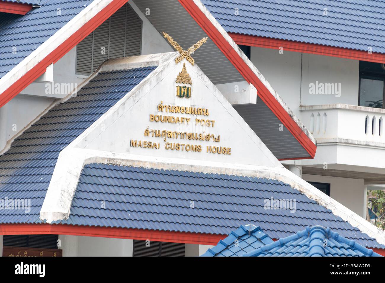 At the busy entrance of the main border crossing between Mae Sai in northern Thailand and ...