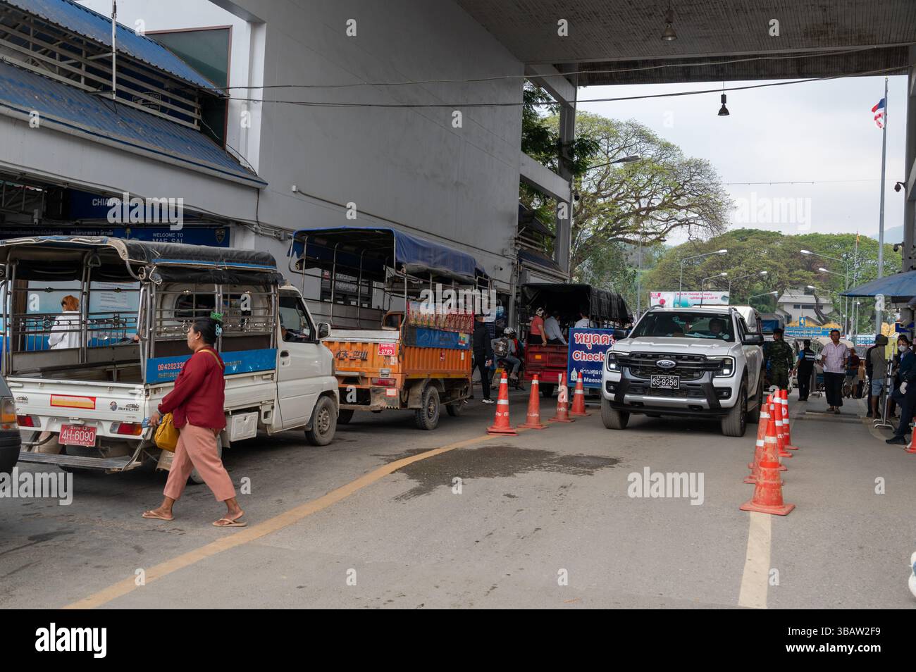 At the busy entrance of the main border crossing between Mae Sai in ...